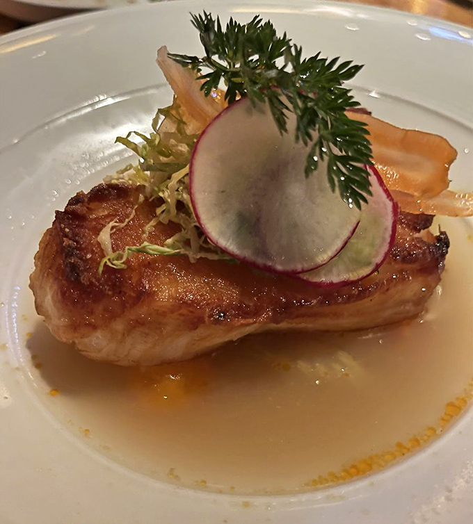 Sea bass with a golden crust that crackles like nature's candy. No wonder Columbus locals speak of this dish in hushed, reverent tones. 