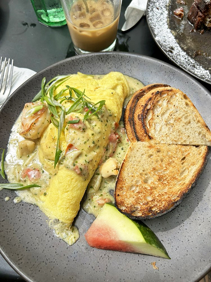This seafood omelet isn't just breakfast—it's an ocean-to-table masterpiece wrapped in the world's fluffiest egg blanket.