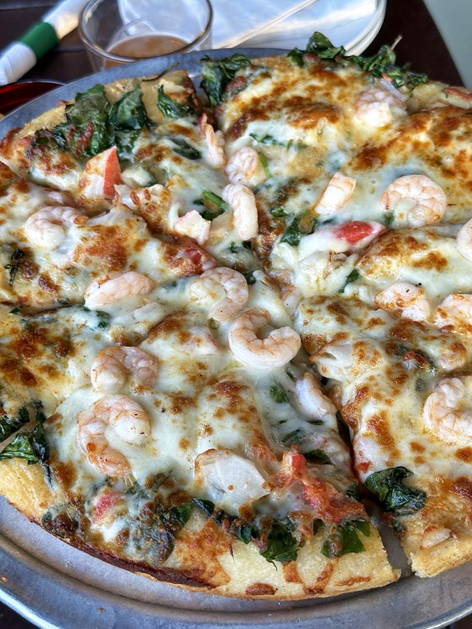 Ocean meets oven in this seafood masterpiece. Those plump shrimp nestled in melted cheese might make you rethink your pizza priorities.