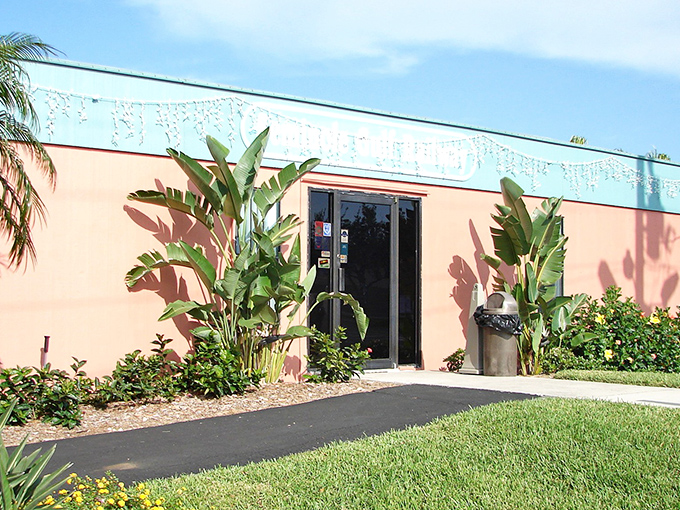 The salmon-colored station with its tropical landscaping screams "Florida!" louder than a retiree who's just spotted an alligator on the golf course.