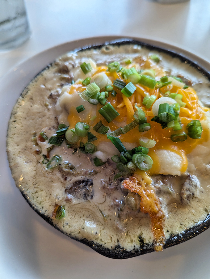Comfort in a crock! This hearty dish topped with melted cheese and green onions is what Midwestern dreams are made of on chilly Lake Erie evenings.