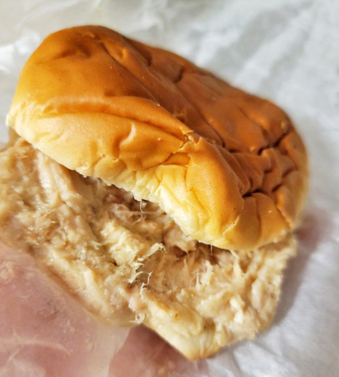 The humble shredded chicken sandwich—Ohio's unsung culinary hero—nestled in a pillowy bun that's seen more happy faces than a kindergarten photographer.