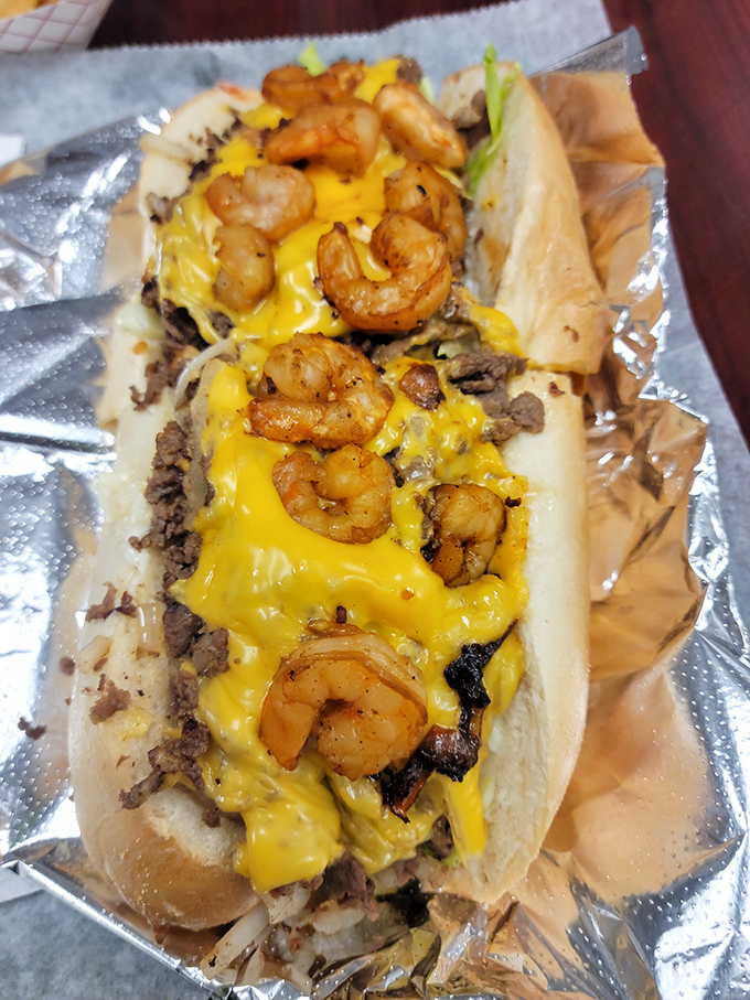 Surf meets turf in sandwich form. These plump shrimp lounging on a bed of steak are like vacationers who found the perfect spot to soak up the cheese.