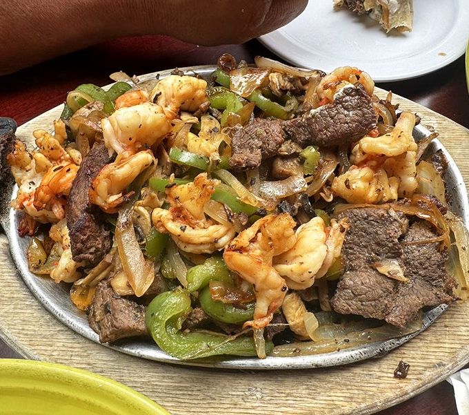 Sizzling shrimp fajitas arrive like a Broadway show &ndash; dramatic entrance, stellar performance, standing ovation from your taste buds.