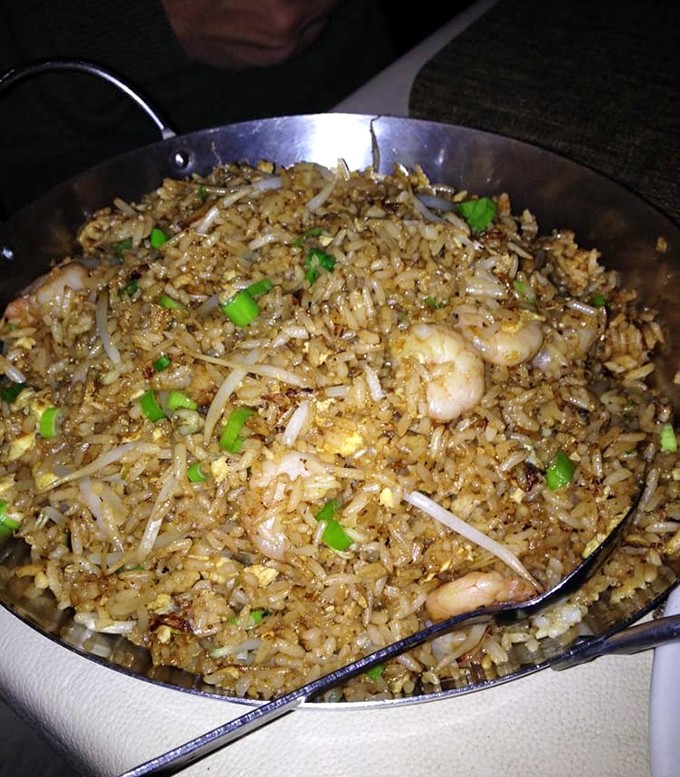 Fried rice that respects the grain. Each morsel maintains its integrity while mingling with shrimp and vegetables in a delicate dance of textures.