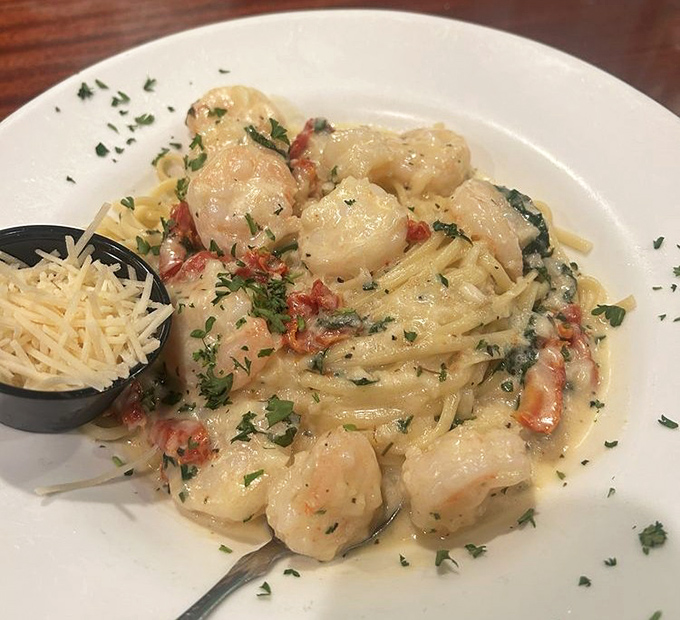 Shrimp scampi that makes you want to write sonnets about garlic butter. Those plump shrimp nestled in pasta look like they're having a better day than most of us.