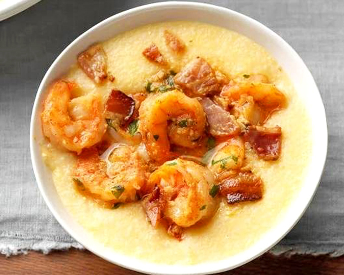 Shrimp and grits: where Southern comfort meets Midwestern hospitality. The bacon adds a smoky counterpoint to the creamy grits.