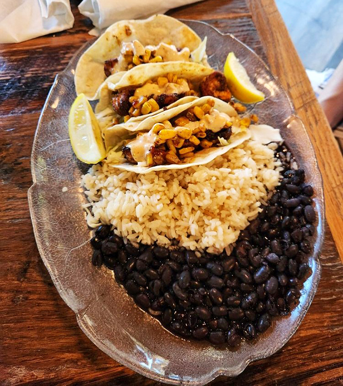 These tacos aren't just food, they're an event&mdash;corn, black beans, and perfectly seasoned seafood creating a fiesta on every plate.