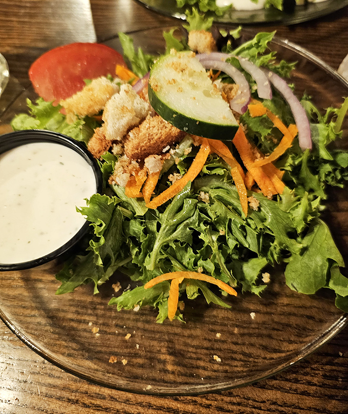 A salad that knows its role&mdash;fresh, crisp supporting actor to the steakhouse stars, with house-made dressing that deserves its own billing.