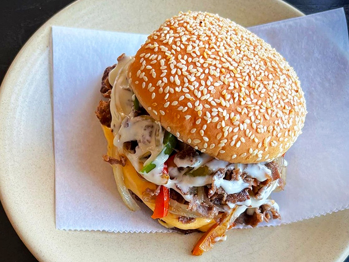 A burger that demands to be eaten with both hands and complete attention. The sesame-studded bun practically winks at you.