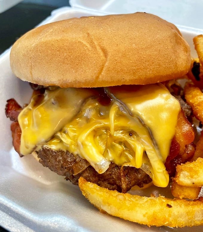 Cheese melting like Salvador Dal&iacute;'s clocks over a perfectly charred patty. This isn't just a burger&mdash;it's performance art you can eat.