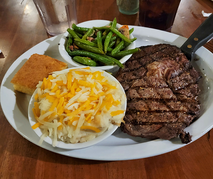 This ribeye isn't just dinner&mdash;it's performance art. The smoke ring tells a story of patience, while those cheesy potatoes whisper sweet nothings to your taste buds. 