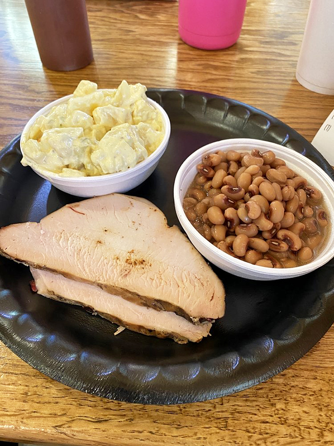 Turkey that defies the "dry poultry" stereotype &ndash; juicy, smoky slices accompanied by creamy potato salad and baked beans that mean business.