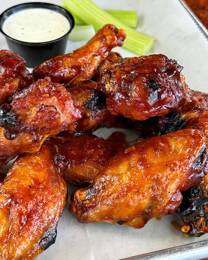 Wings so gloriously lacquered they could hang in an art museum, if museums were cool enough to display food this beautiful.