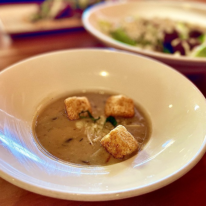 This mushroom soup isn't just a starter&mdash;it's a revelation in a bowl. Those croutons are like little life rafts in a sea of earthy goodness.