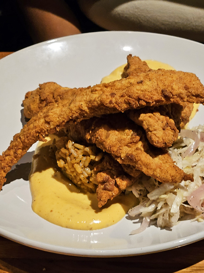 This Southern fried catfish isn't just dinner; it's a crunchy, golden ticket to flavor town, complete with creamy sauce.