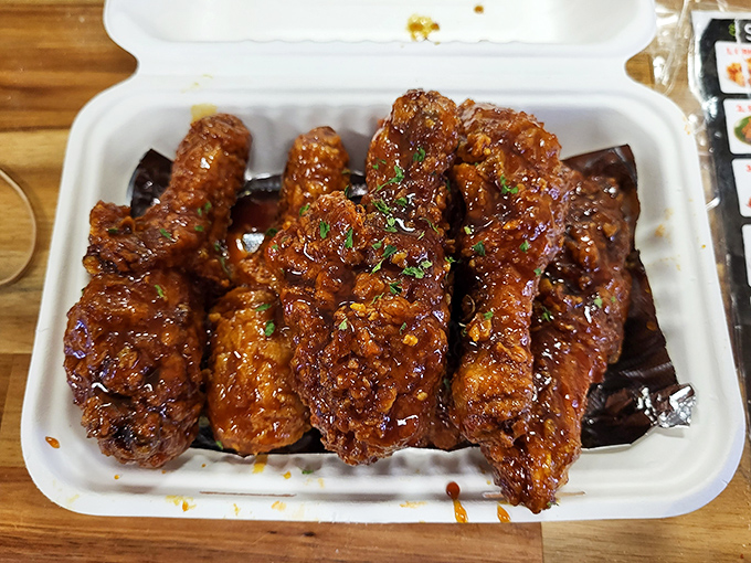 Soy garlic chicken glistening like edible jewelry &ndash; if diamonds tasted this good, we'd all be broke.