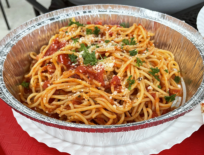 Spaghetti that proves simplicity is the ultimate sophistication. That dusting of parmesan and fresh herbs isn't just garnish&mdash;it's the crown jewels.
