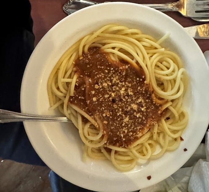 Spaghetti with a hearty sauce and a generous dusting of cheese&mdash;proof that even in a steakhouse, pasta deserves its moment in the spotlight.