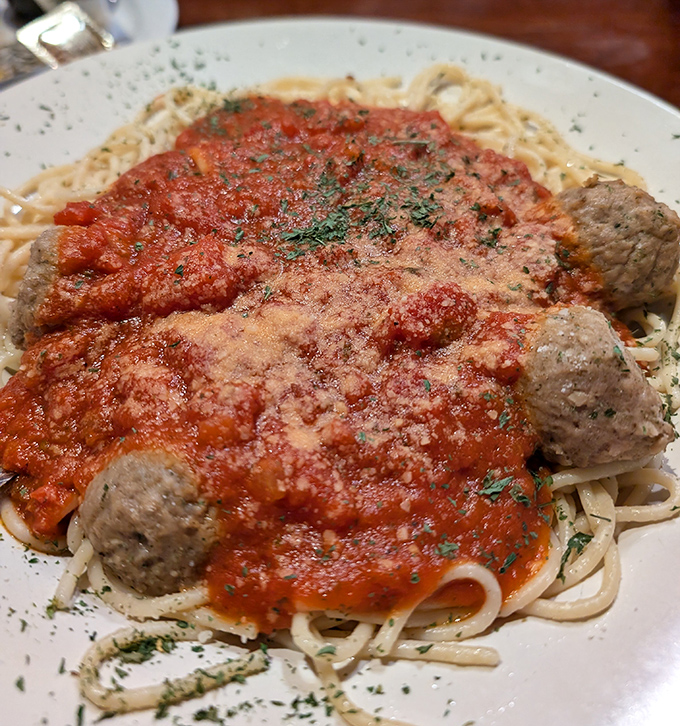 Spaghetti and meatballs done right, where every strand gets coated in sauce that tastes like Sunday dinner.