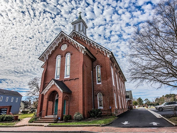 St. Luke's Methodist Church stands proudly against a mackerel sky, its brick façade having witnessed generations of both prayers and gossip.