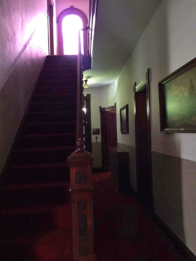 That staircase isn't just leading upstairs&mdash;it's practically a time machine to the 1800s. Notice how the light creates that perfect horror movie ambiance?