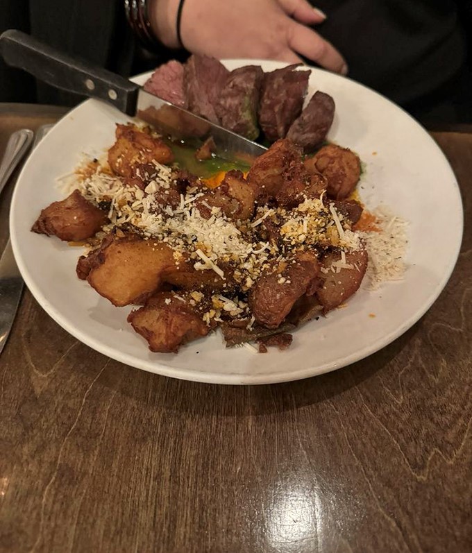 Perfectly seared steak shares the spotlight with crispy potatoes dusted with cotija cheese&mdash;proof that simplicity executed flawlessly needs no fancy tricks.