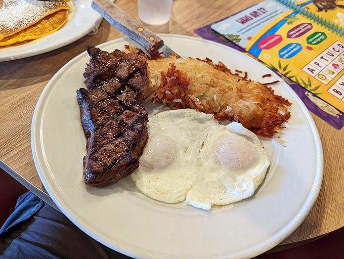 Steak and eggs: the breakfast of champions who plan to skip lunch. Those hash browns deserve their own fan club.