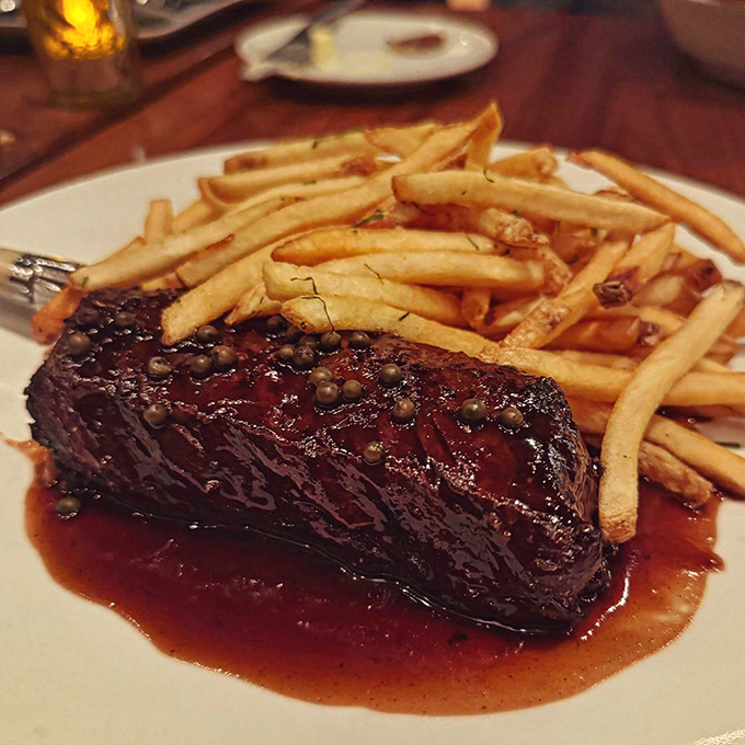 This isn't just steak frites&mdash;it's therapy on a plate. The glistening peppercorn sauce makes a compelling case for licking the plate when nobody's watching.