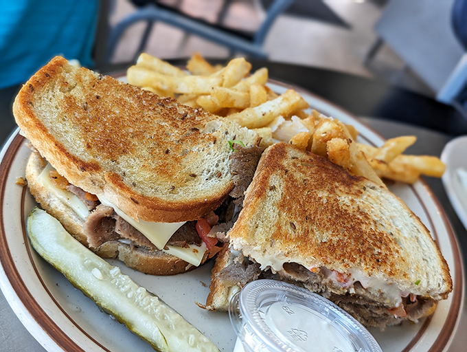 This isn't just a sandwich; it's architecture with flavor. Perfectly grilled bread holding tender steak—proof that simplicity done right is culinary genius.