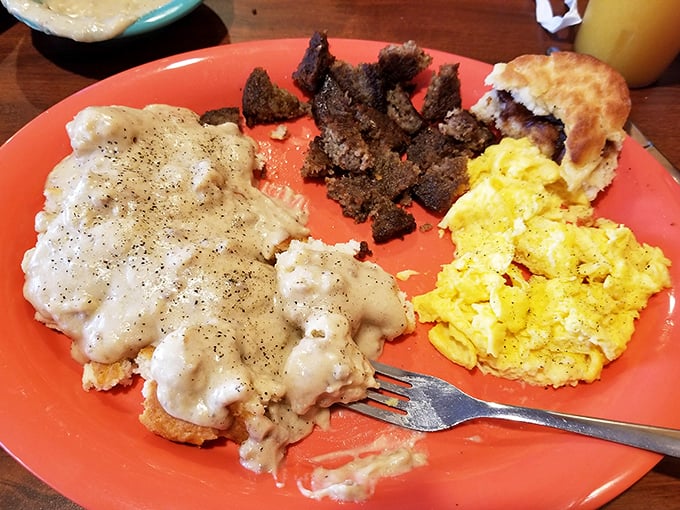 Breakfast of champions! Savory steak, scrambled eggs, and a biscuit that could make your grandmother question her own recipe.