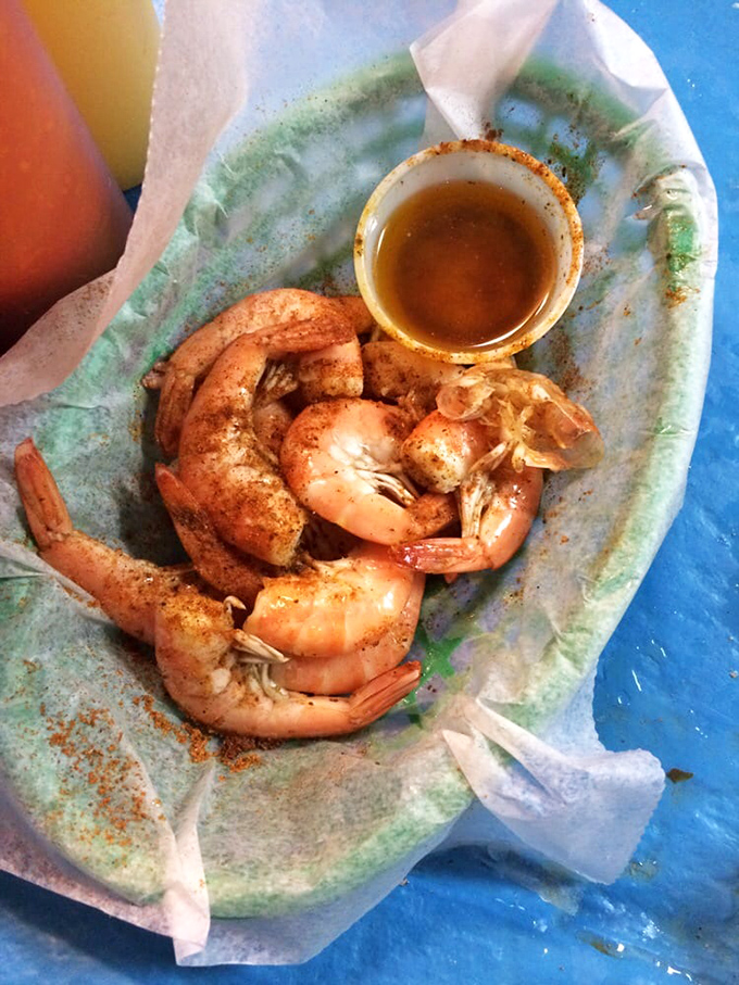 These plump, spice-dusted shrimp aren't just seafood&mdash;they're little pink crescents of oceanic joy, waiting for their butter bath before their final destination.