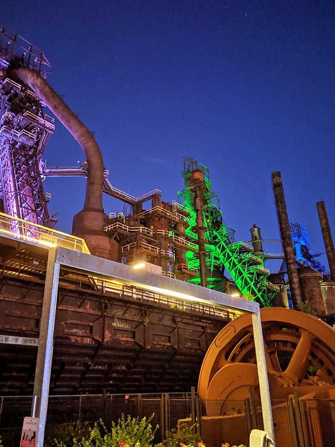 By night, the former Bethlehem Steel blast furnaces transform into a technicolor industrial cathedral, proving that sometimes a city's past can light the way to its future.