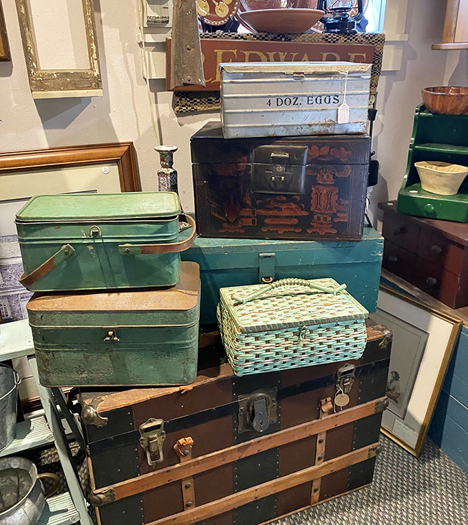 Vintage luggage stacked like a game of Tetris played by time travelers with excellent taste.