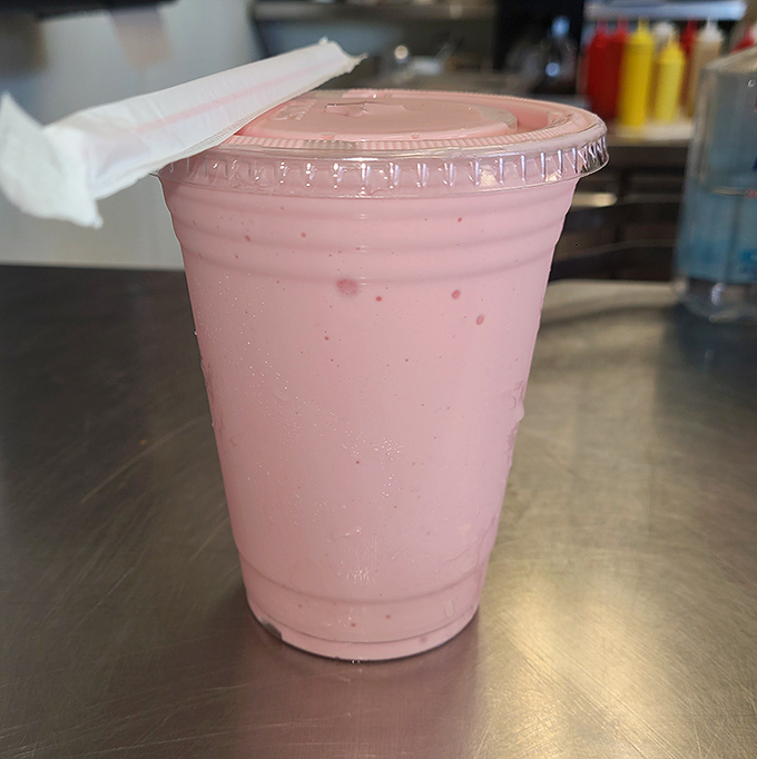 The strawberry milkshake that launched a thousand return visits. Pink, creamy, and thick enough to make your straw stand at attention.