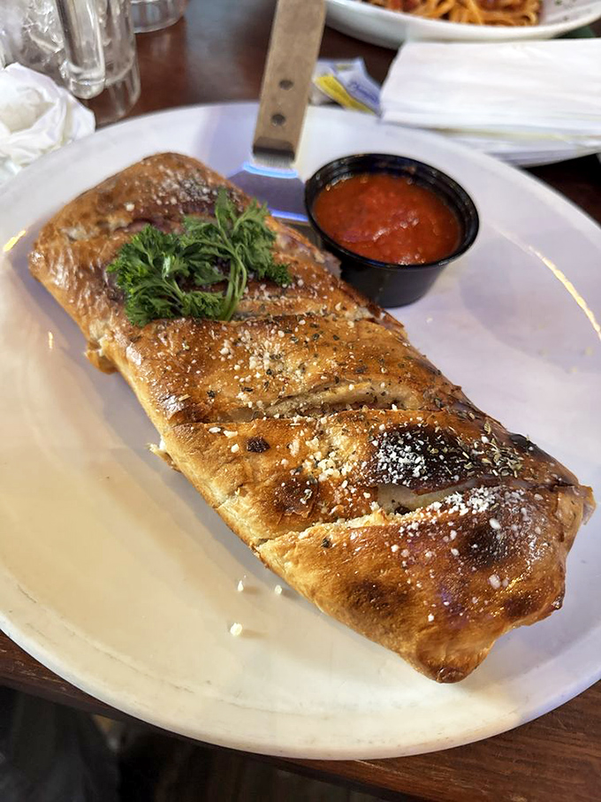 This isn't just a stromboli&mdash;it's edible architecture with a golden-brown dome that would make Michelangelo weep with joy.
