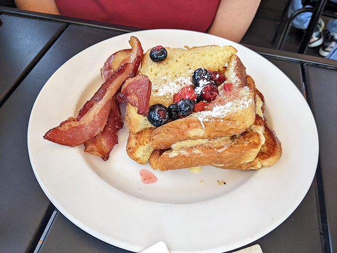 French toast that's had an existential crisis and emerged better for it&mdash;stuffed, berry-topped, and flanked by bacon sentinels.