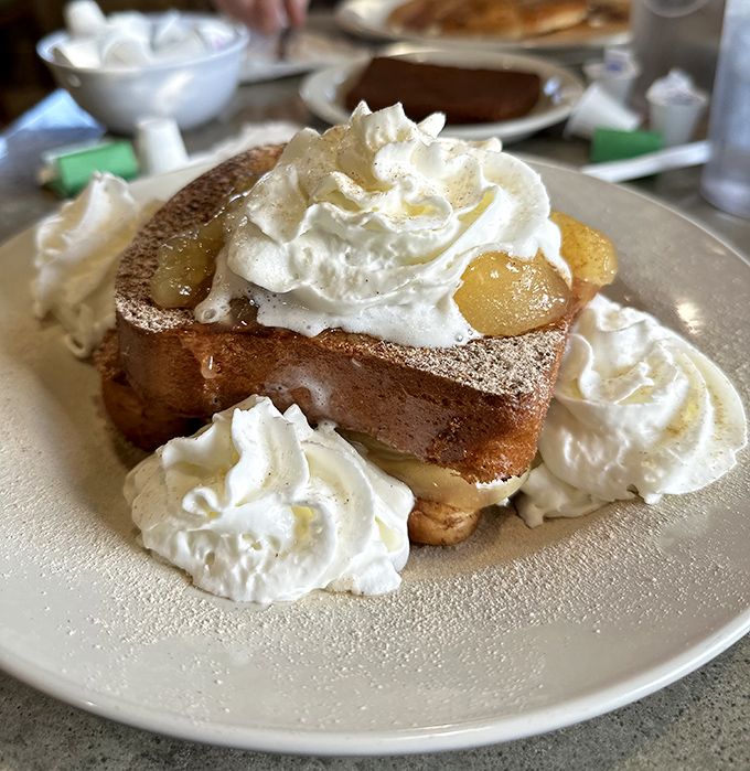 This isn't just French toast&mdash;it's a pillowy challah creation that's having a whipped cream party. Breakfast or dessert? Yes, please.