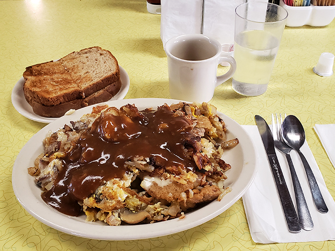 Gravity-defying hash browns smothered in gravy&mdash;the kind of breakfast that makes you want to cancel lunch and possibly dinner too.