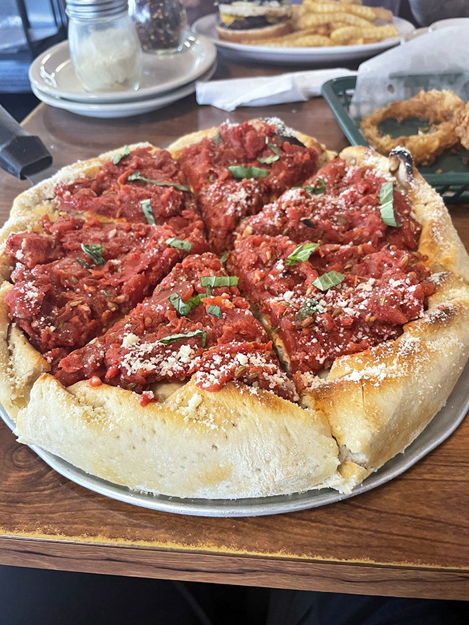 Pizza or art installation? This deep-dish beauty with its chunky sauce and fresh herbs makes a compelling case for both.