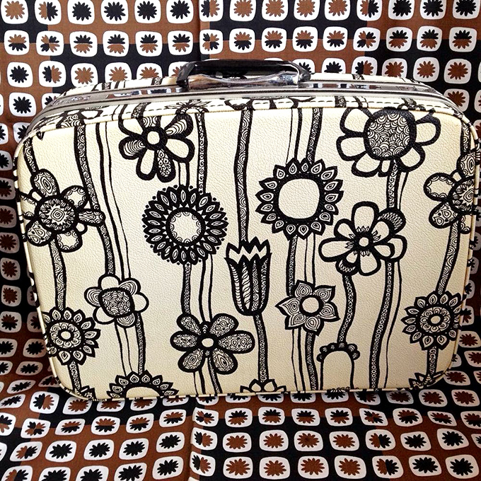 This flower-adorned vintage suitcase doesn't just carry clothes&mdash;it carries stories. Imagine the places it's been before landing in Chicago!