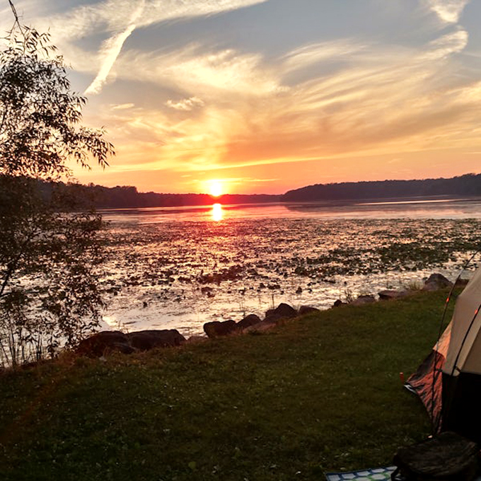Nature puts on its best evening show at Indian Lake, where sunsets transform ordinary water into liquid gold worth more than any stock portfolio.