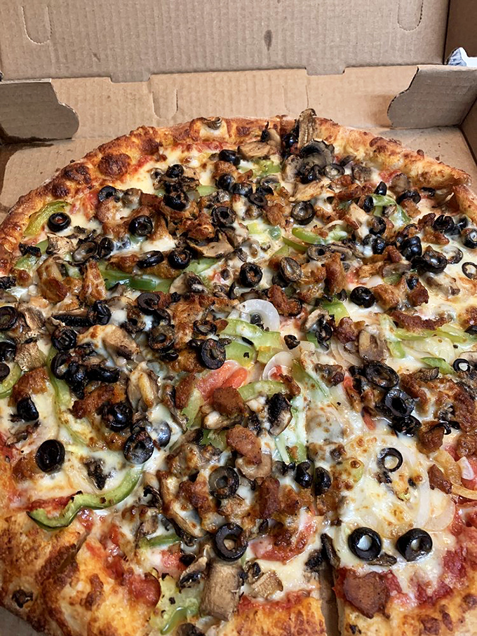 The supreme pizza lives up to its royal name with a kingdom of toppings. Black olives, green peppers, and savory meats create a harmonious flavor parliament.