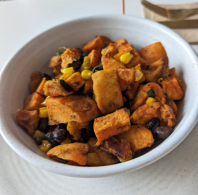 Sweet Potato Hash that's doing the impossible &ndash; making vegetables the most exciting thing on the table. Those colors could brighten anyone's morning.