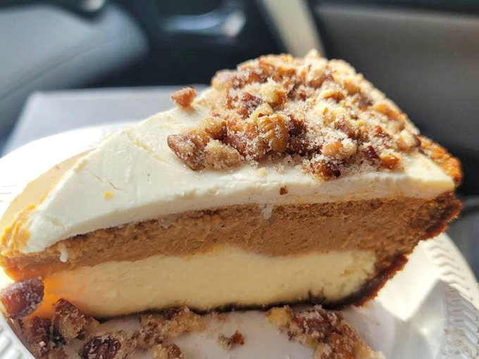 Layers of sweet potato cheesecake goodness topped with what appears to be candied pecans &ndash; Southern comfort reimagined as California luxury.