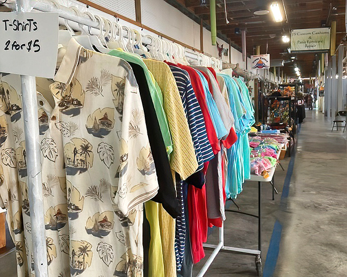 The T-shirt wall&mdash;where Florida vacation memories and tropical patterns stand at attention, waiting to transform your wardrobe for the price of a fancy coffee.