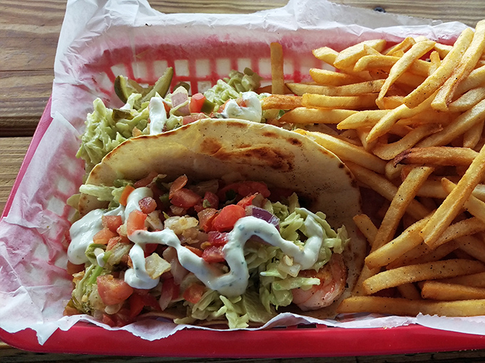 This taco isn't just food, it's a coastal vacation wrapped in a tortilla, where seafood meets fresh veggies in perfect harmony.