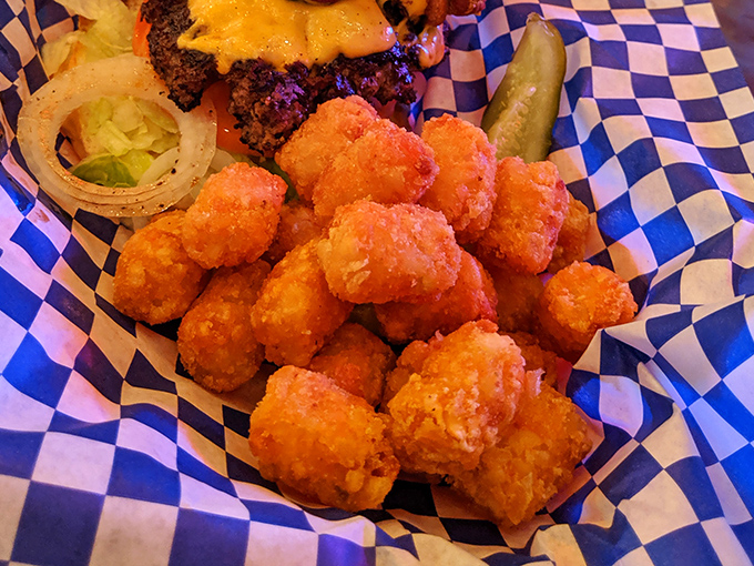 Golden-brown tater tots: childhood nostalgia transformed into the perfect adult comfort food. Crispy outside, fluffy inside, and absolutely essential with that burger.