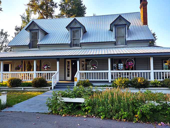 The Bidwell House wraps visitors in classic mountain elegance with a porch that practically demands you sit a spell with something warm to drink.