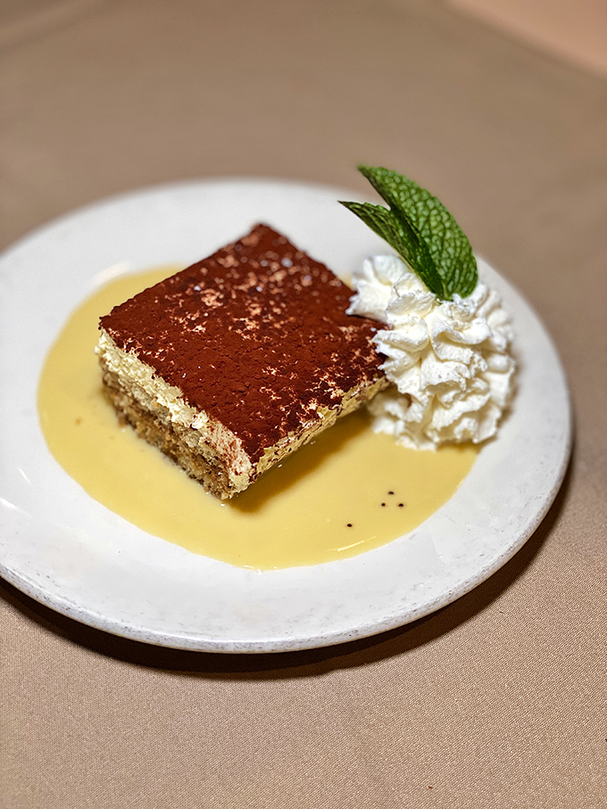 Their tiramisu provides the perfect sweet finale, swimming in custard sauce that makes you wonder why you ever considered skipping dessert.